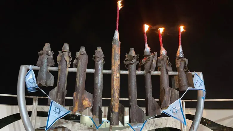 Hanukkah menorah made of rocket fragments lit on Gaza-area yeshiva ...