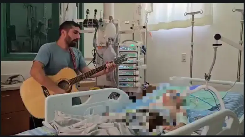 Singer Avihai Hollender plays at his 7-year-old nephew's bedside ...