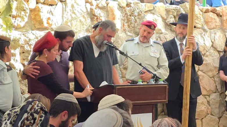 Bereaved father sings haunting song about sacrifice over son's grave ...